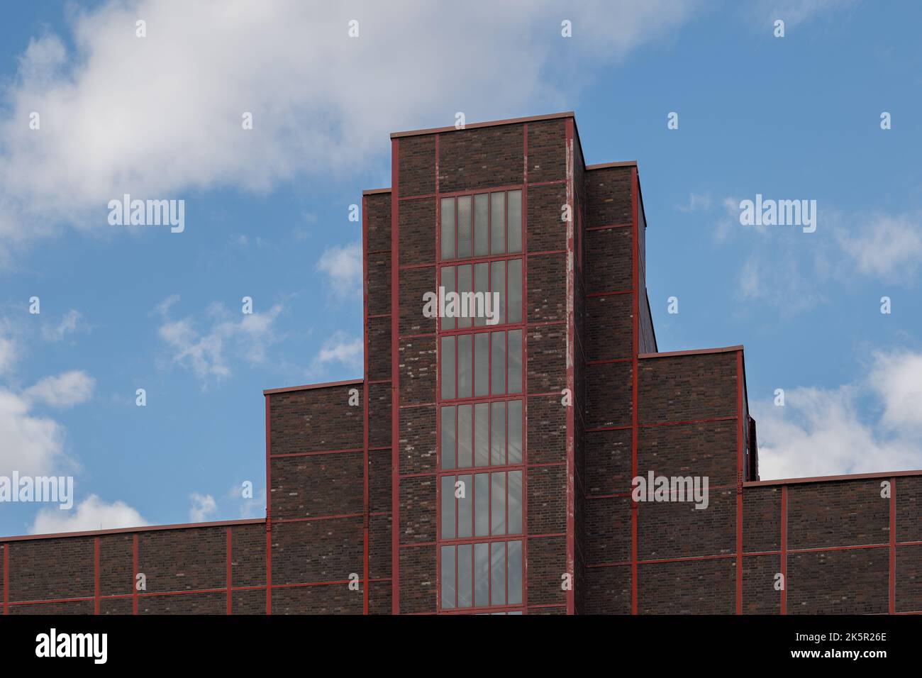 Detail's facade of old industrial or factory building with rough red ...