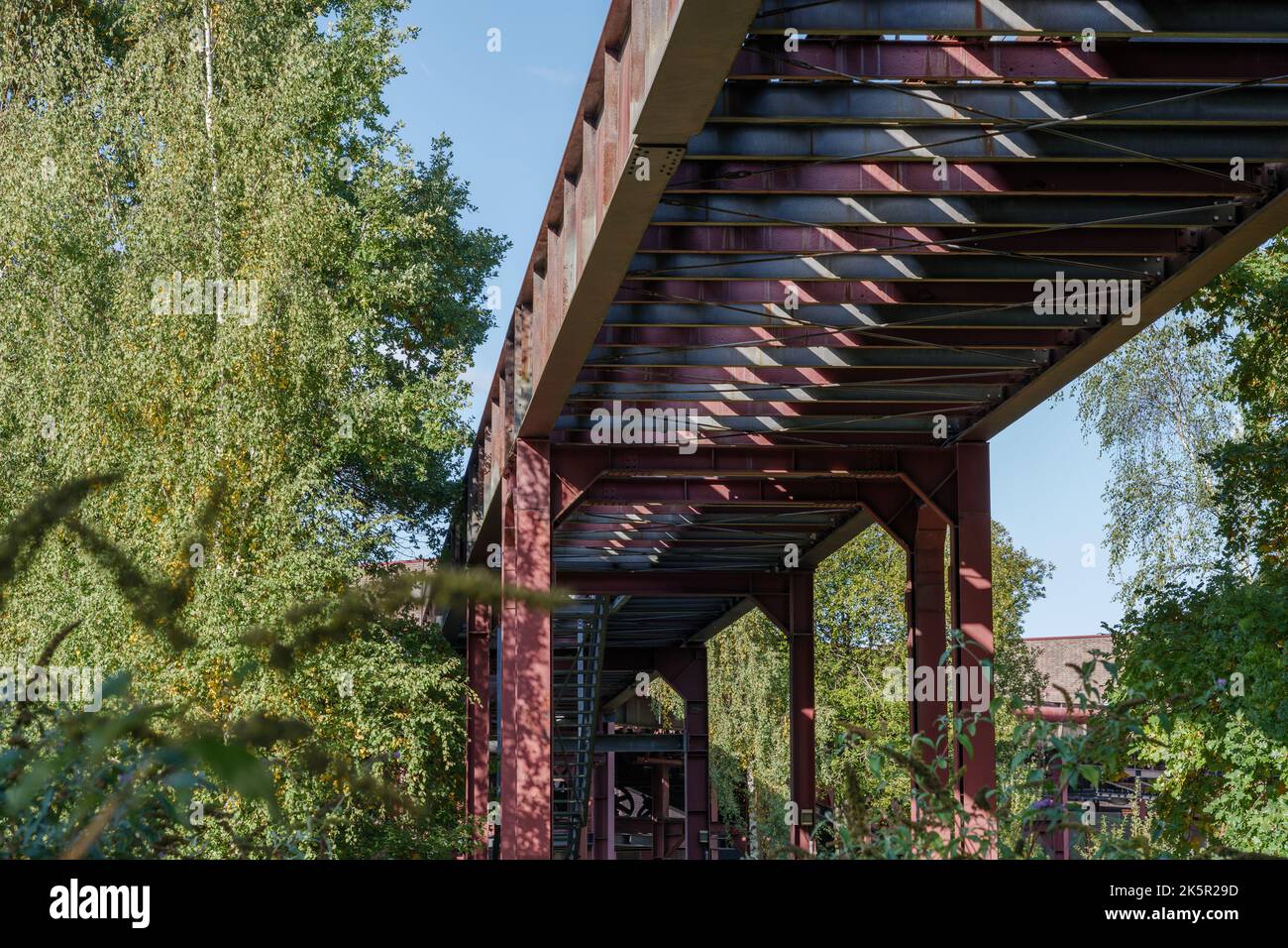 View under rail bridge for mine cart surrounded by park at Zeche ...