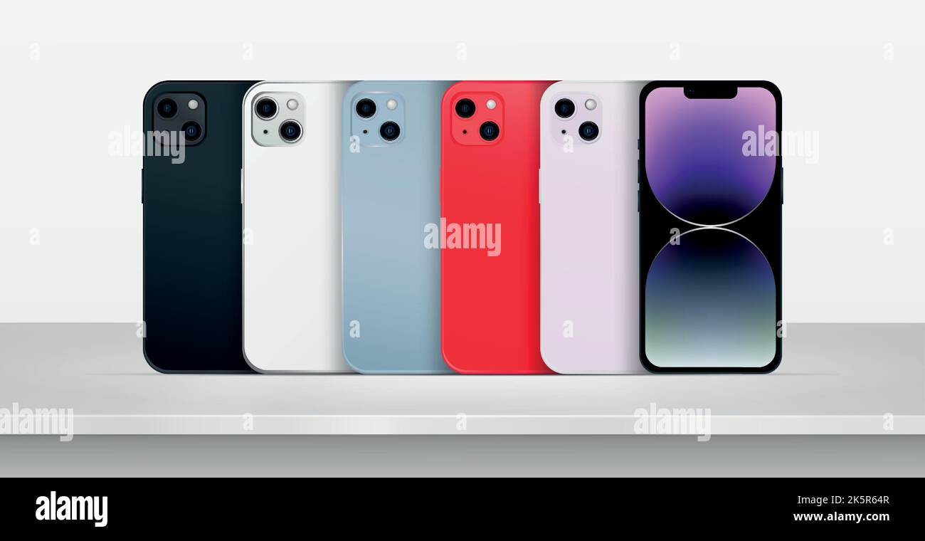 Modern smartphones of different colors standing on the table, white ...