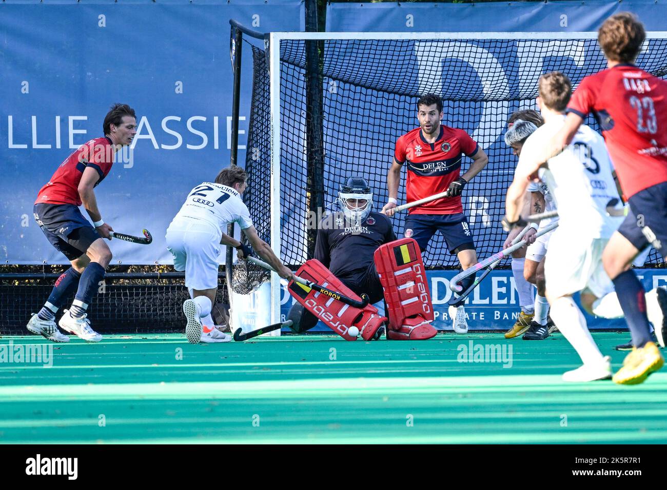 Racing's Diego Lucaccioni and Dragons' goalkeeper Loic Van Doren ...