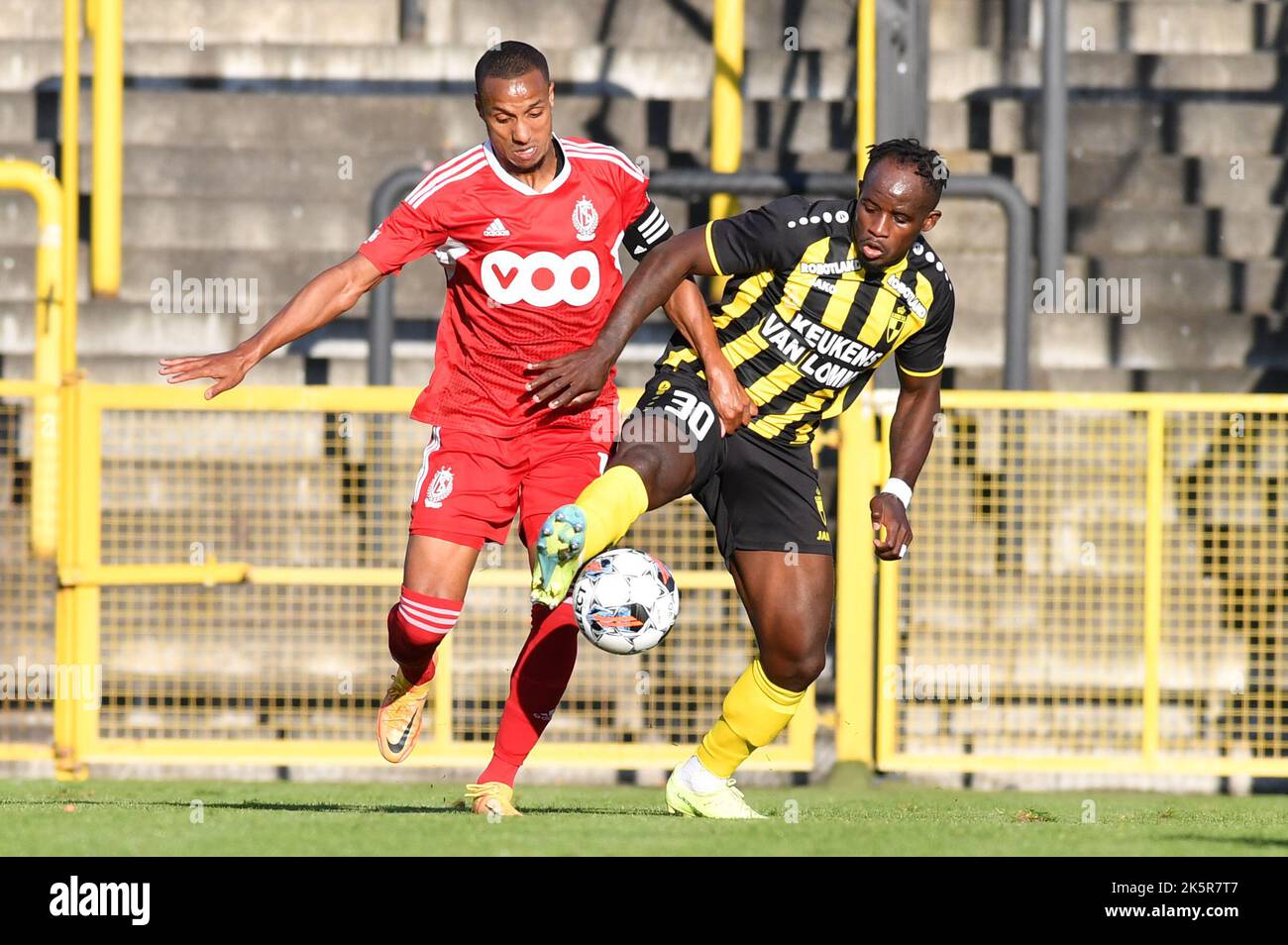 SL16's Frederic Duplus and Lierse's Serge Tabekou pictured in action ...