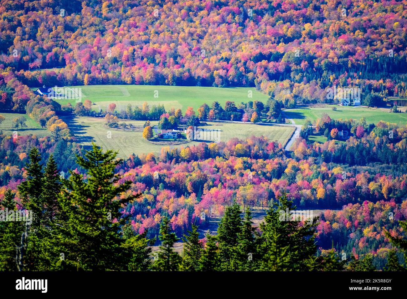 The vibrant colors of autumn foliage surround White Rock Mountain in ...