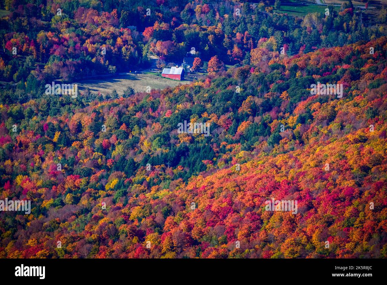 Red barn and the vibrant colors of autumn foliage surround White Rock ...