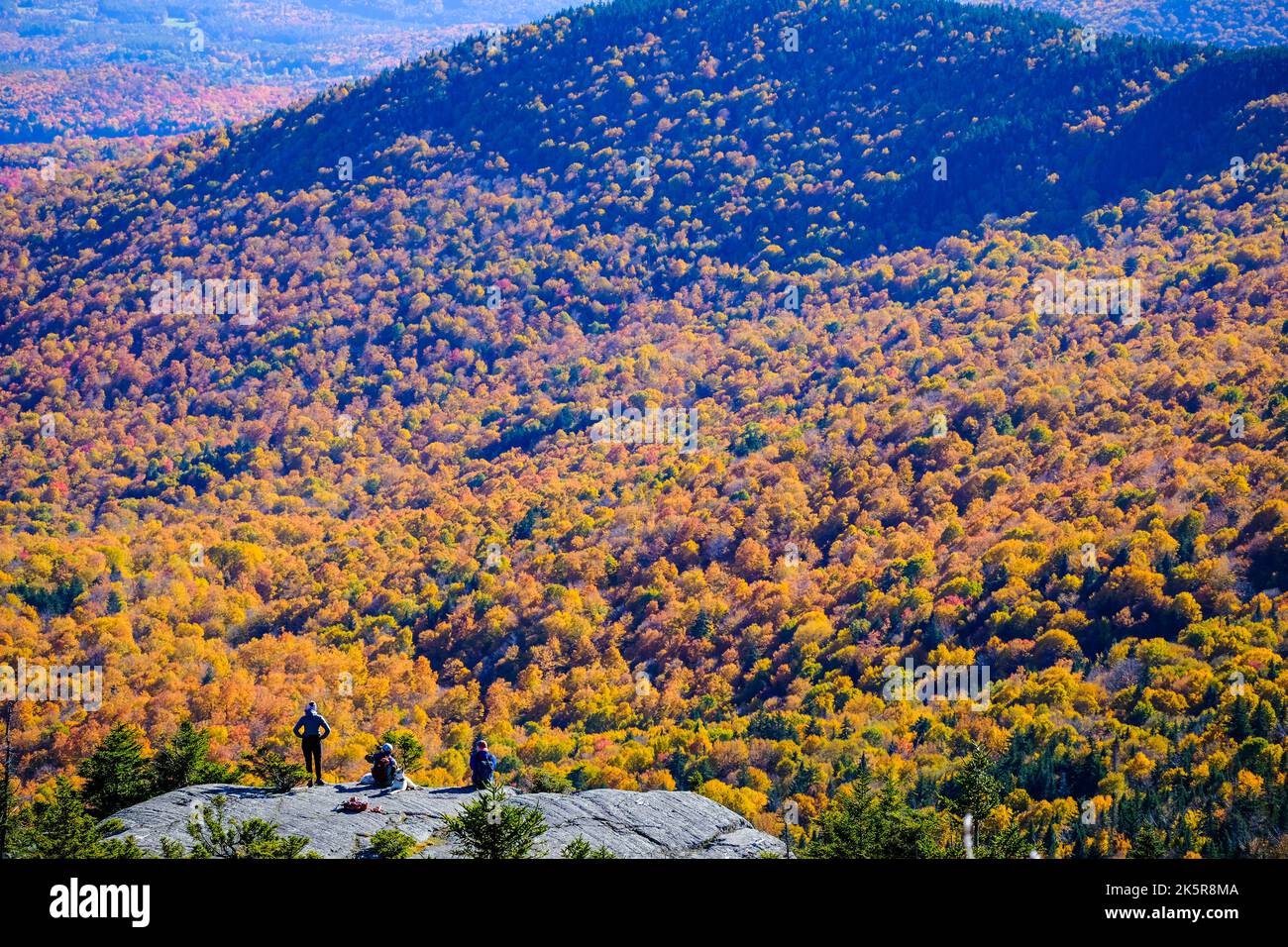 The vibrant colors of autumn foliage surround White Rock Mountain in ...