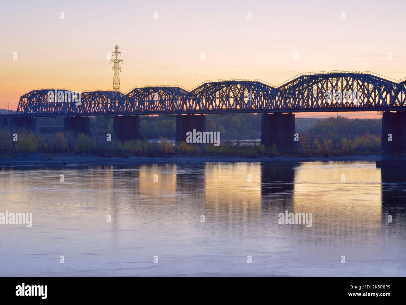 Dawn at the railway bridge. Crossing the Ob of the Trans-Siberian ...