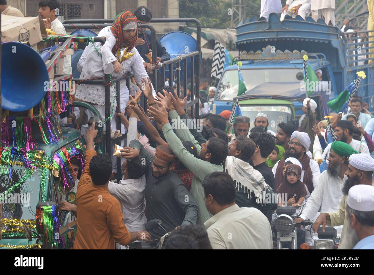 Pakistani faithful devotees participate in a procession of Eid Milad-un ...