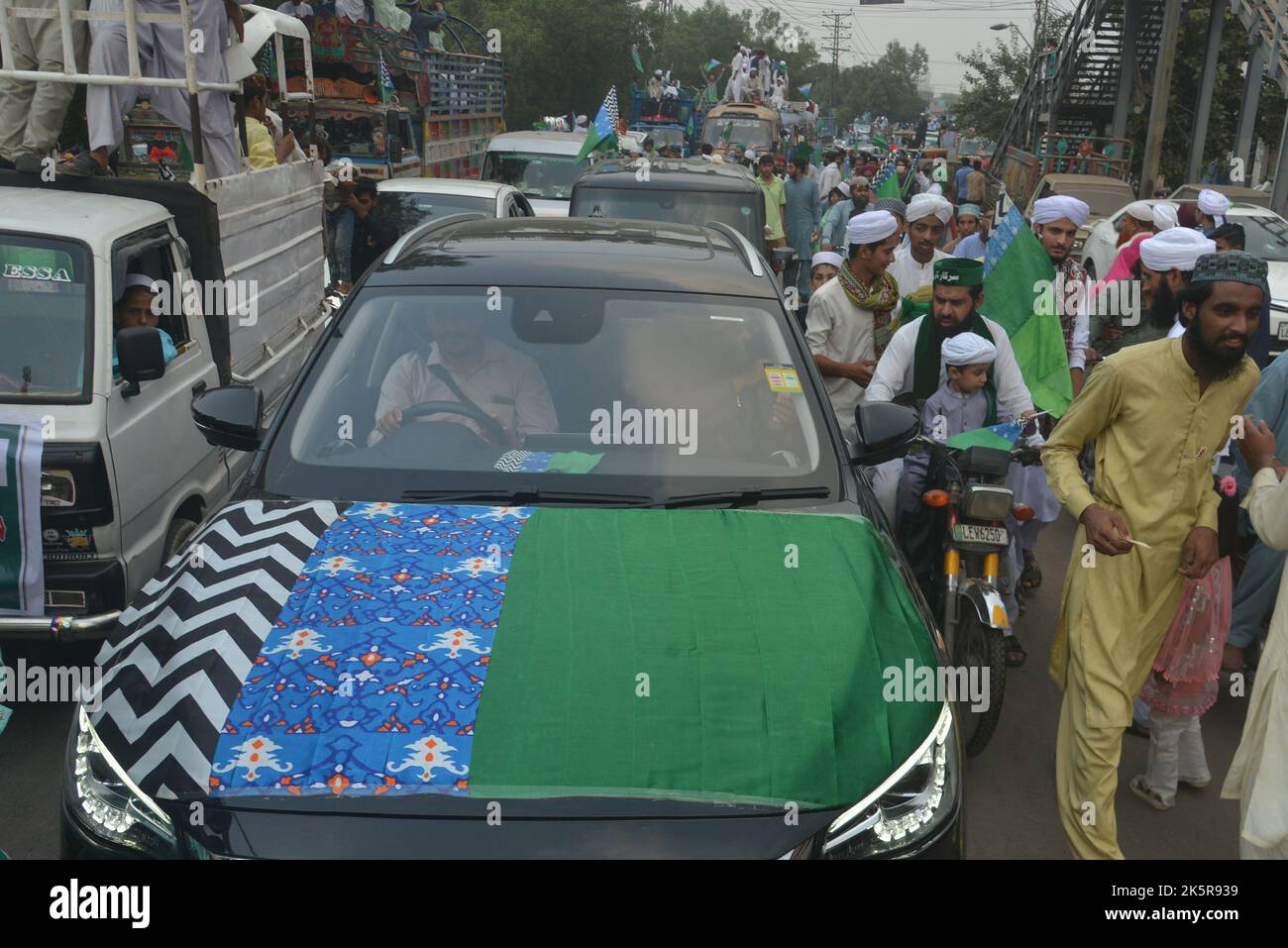 Pakistani faithful devotees participate in a procession of Eid Milad-un ...
