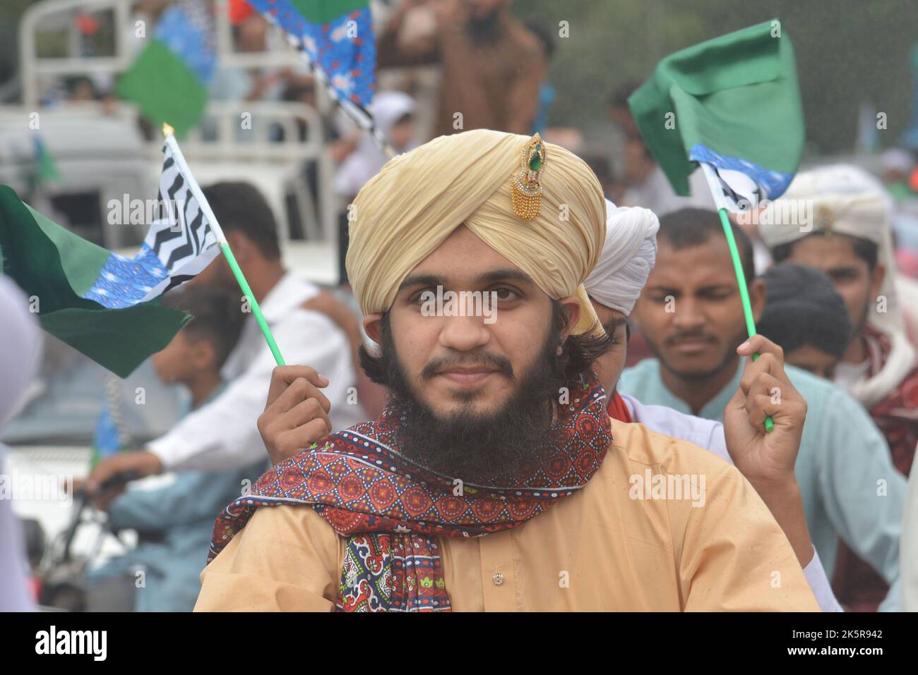 Pakistani faithful devotees participate in a procession of Eid Milad-un ...