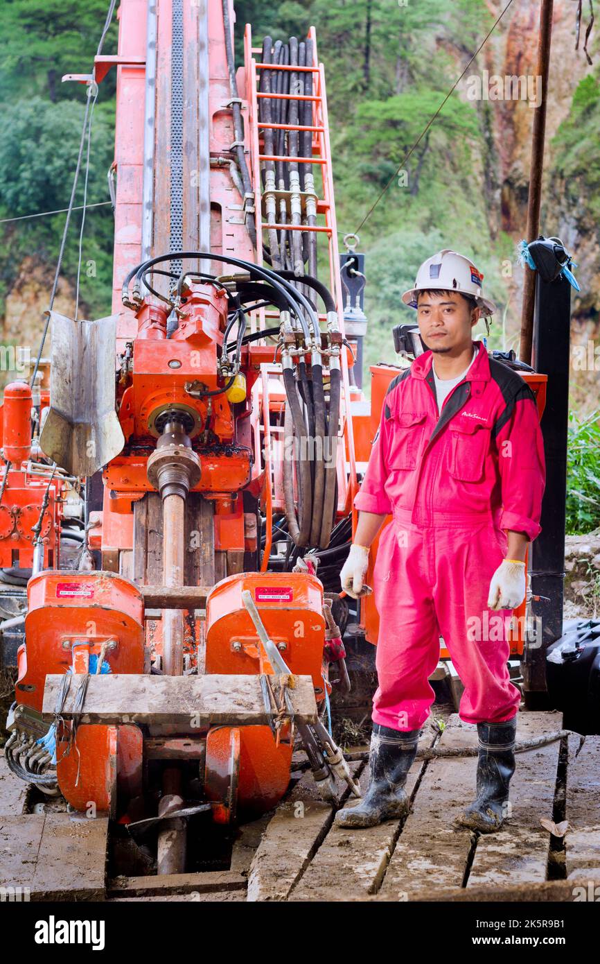 A worker at a gold mine and processing plant in Benguet, Philippines ...