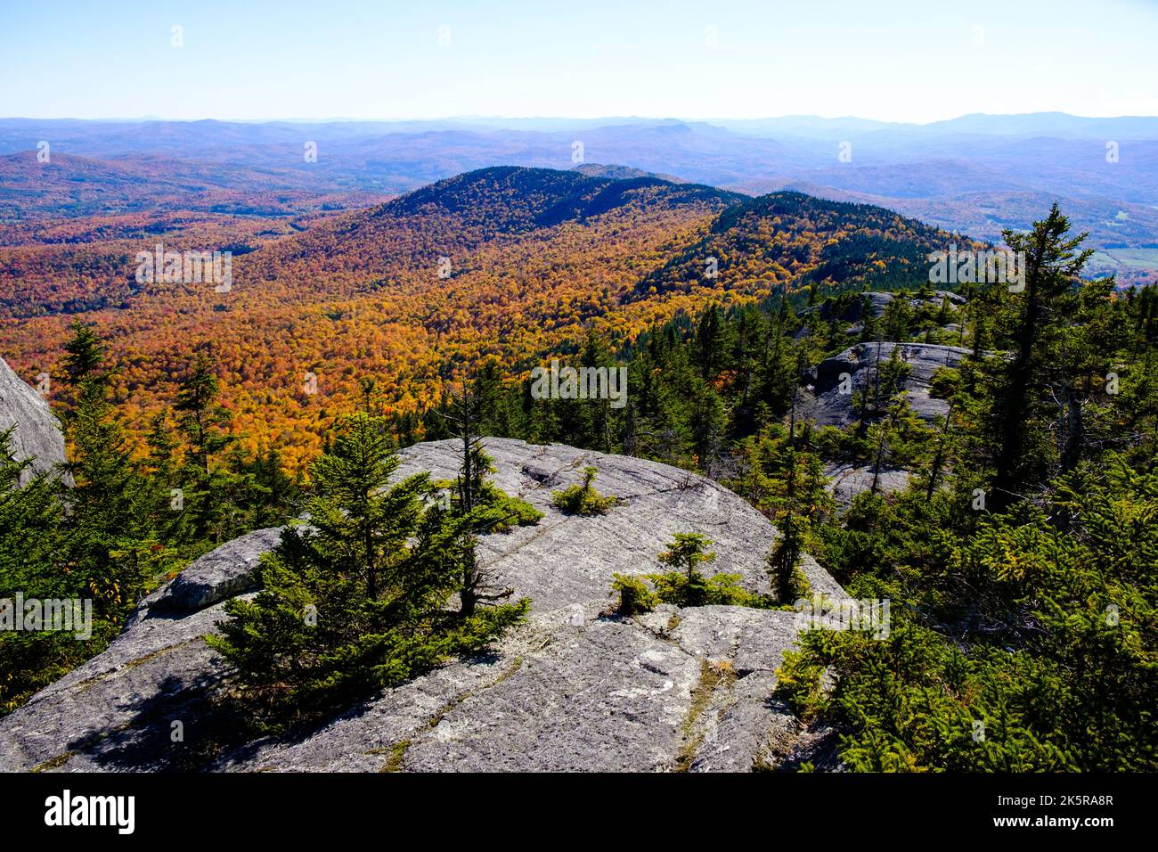 The vibrant colors of autumn foliage surround White Rock Mountain in ...