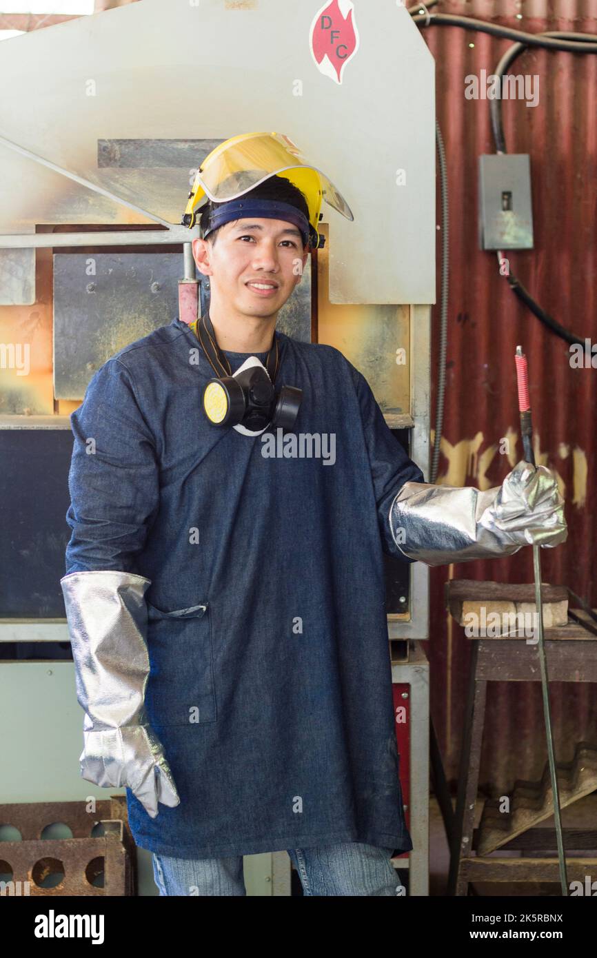 Furnace worker at a gold mining processing plant in Benguet ...