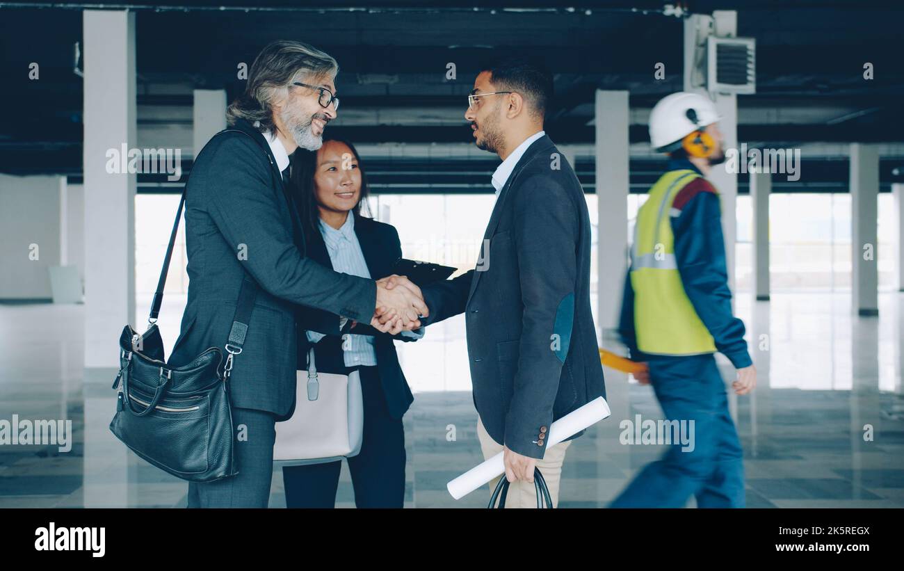 Industrial building owners are meeting with Arab businessman discussing ...