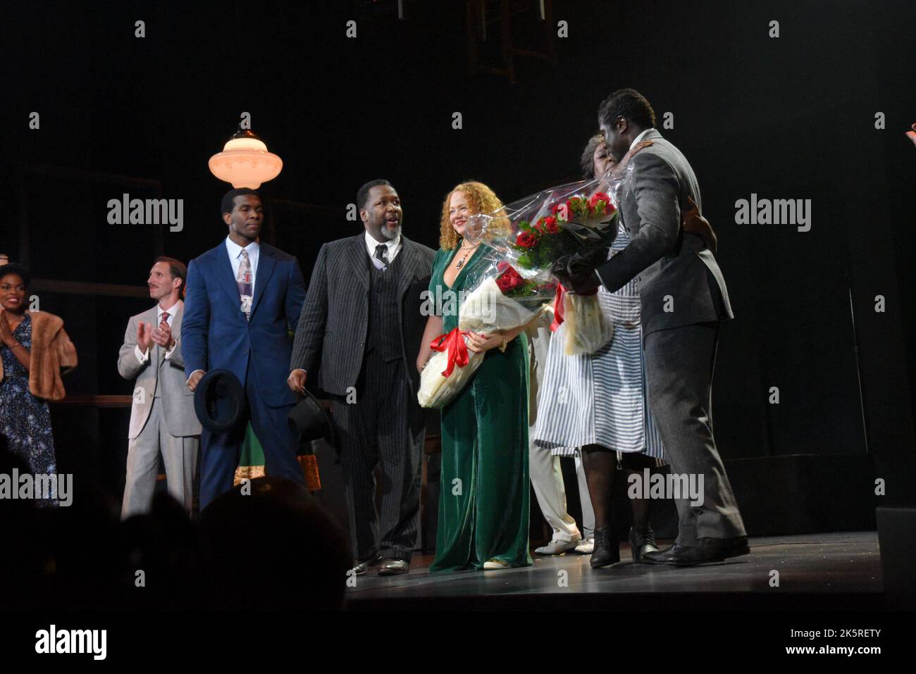 The cast, with director Miranda Cromwell, bow during the curtain call ...