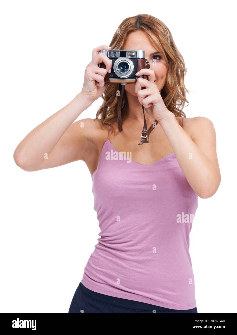 Photography is her new favorite hobby. Studio shot of a young woman ...