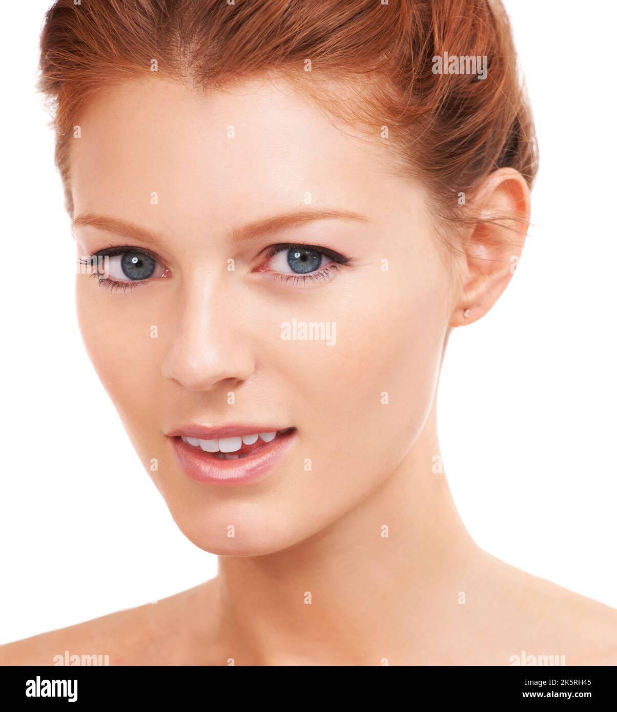 Stunning beauty with clean skin and soft smile. Isolated closeup of a ...