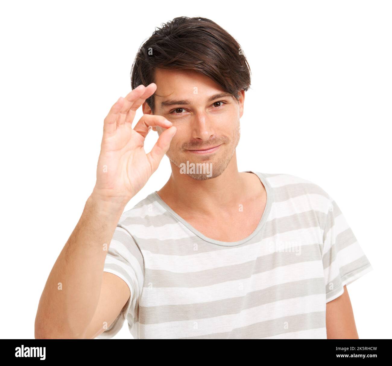 I think youre just perfect. Handsome young man showing you the symbol ...