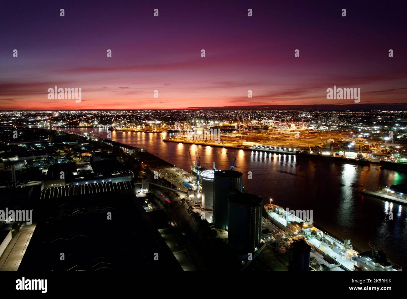 A bird's eye view of Melbourne docks and city lights at sunset Stock ...