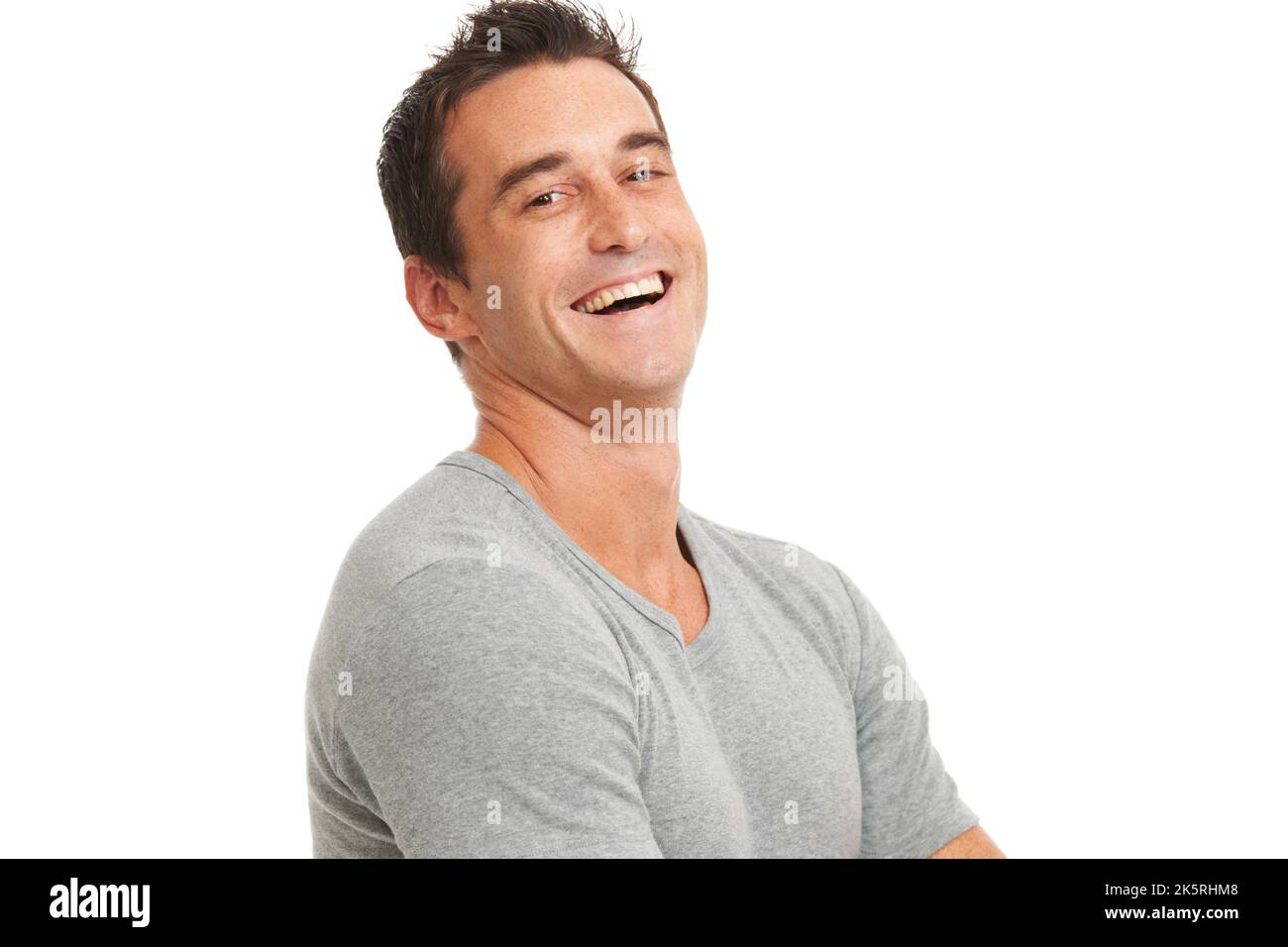 Clean-cut and carefree. Studio shot of handsome man isolated on white ...