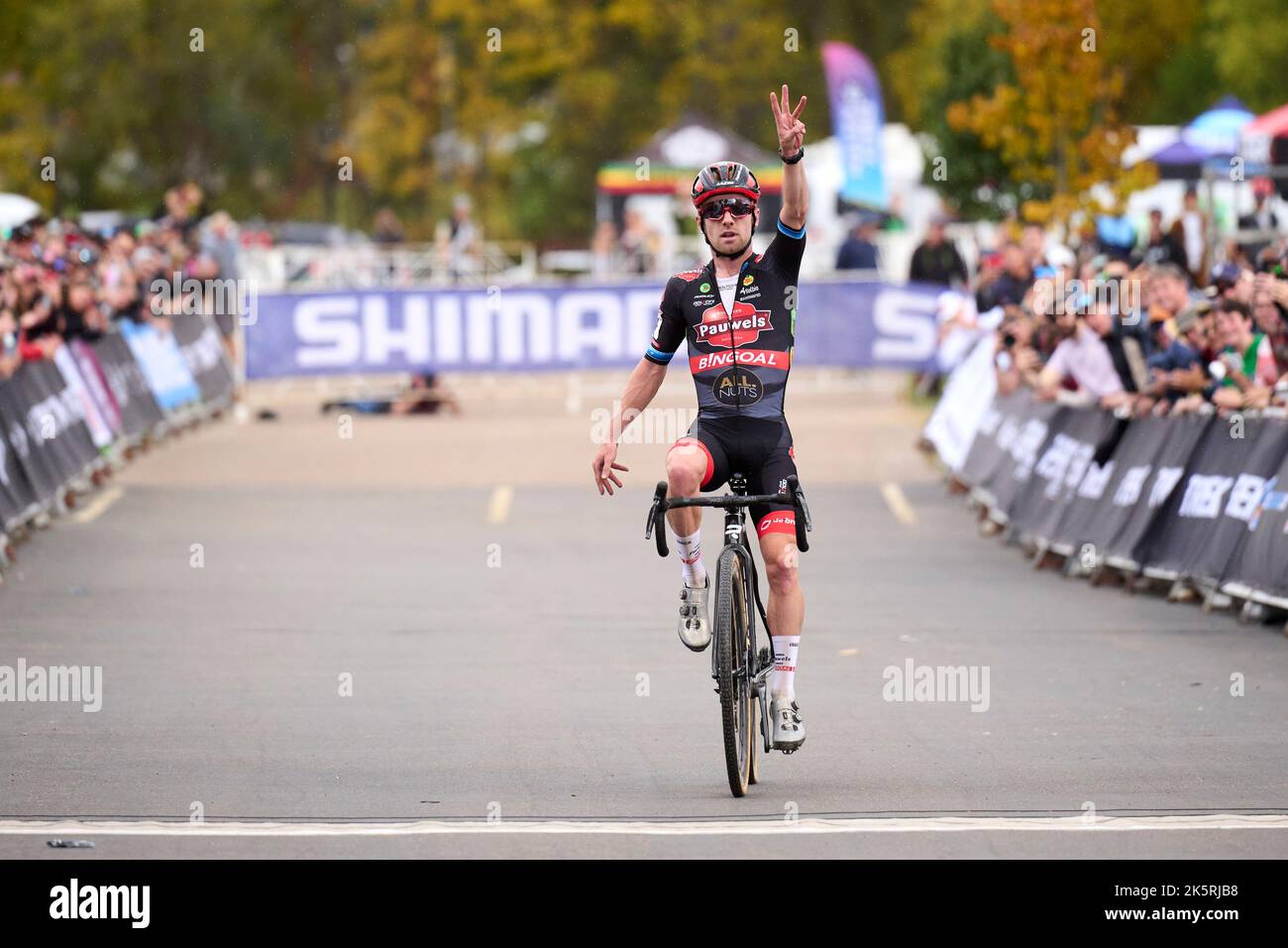 Belgian Eli Iserbyt celebrates as he crosses the finish line to win the ...