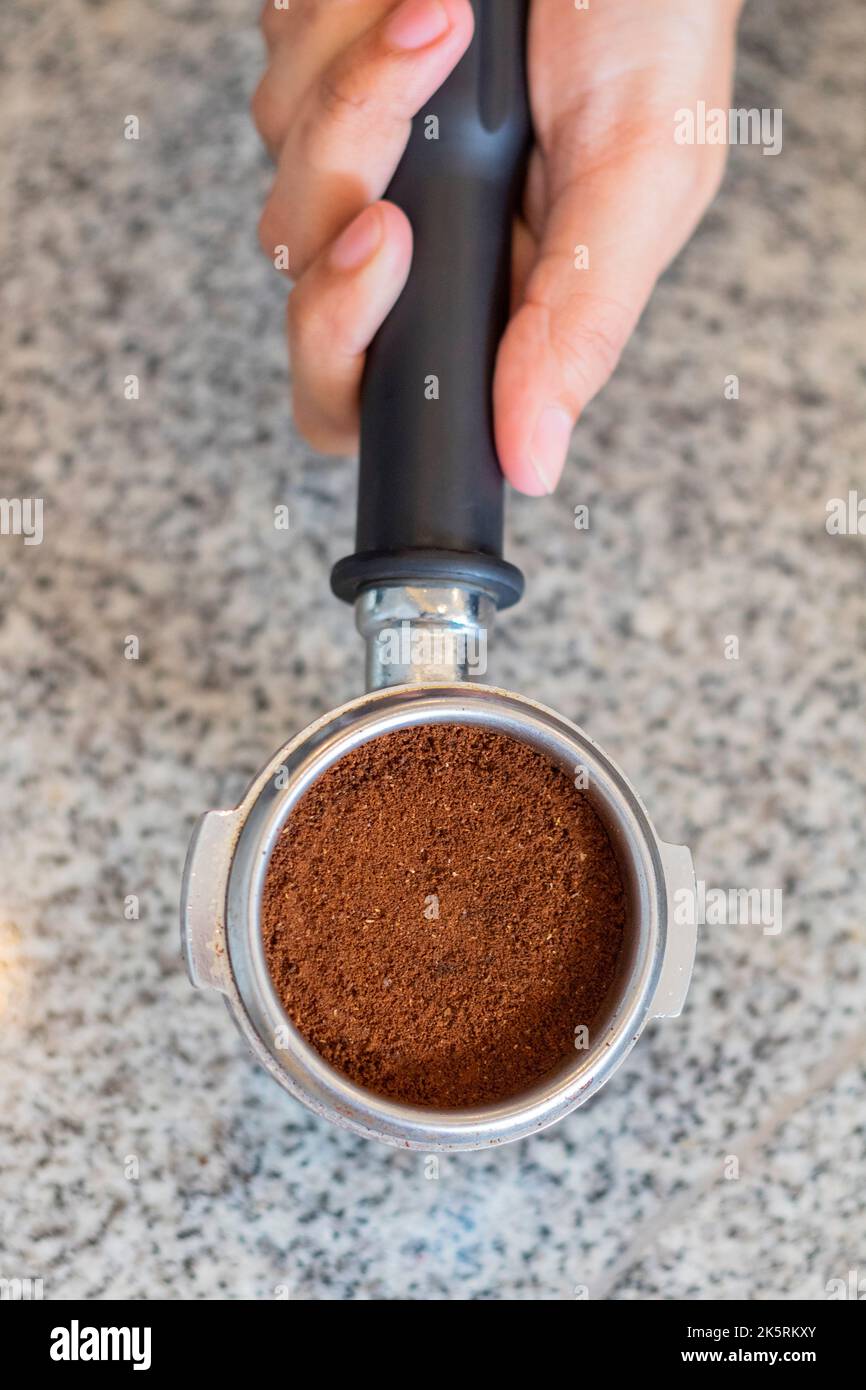 Freshly ground coffee for making espresso at a local cafe in Cebu City ...