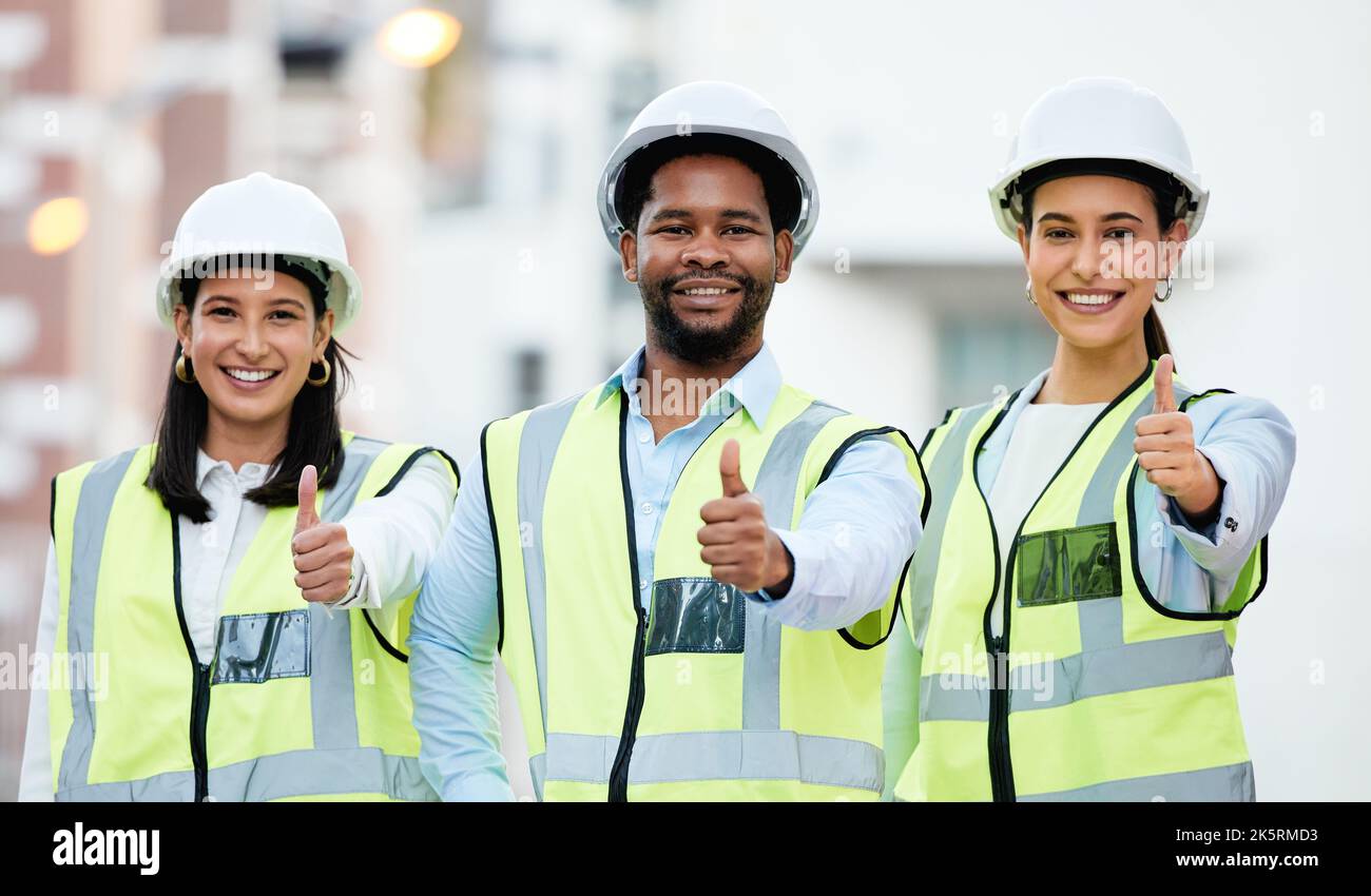 Construction worker, hands and thumbs up by team at construction site ...