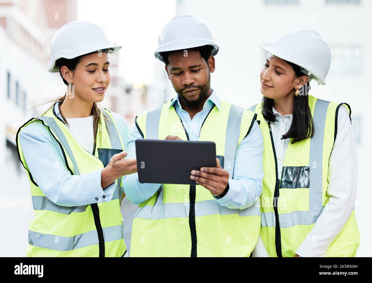 Building, digital tablet and construction worker team collaboration and ...