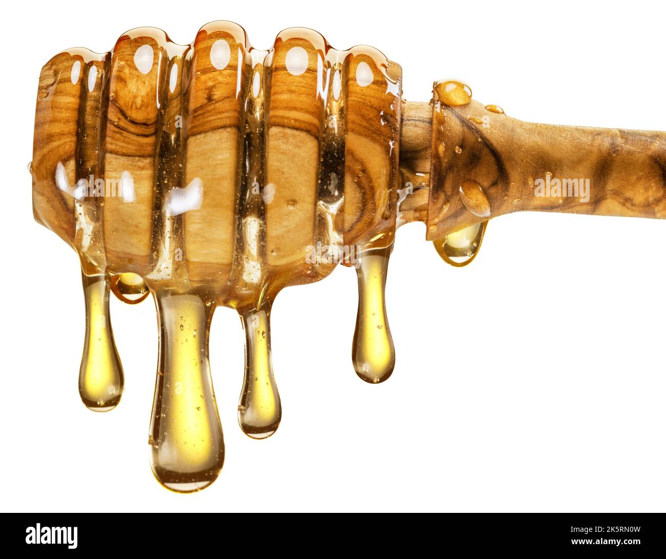 Honey wooden dipper (stick) with large drops of honey on a white ...
