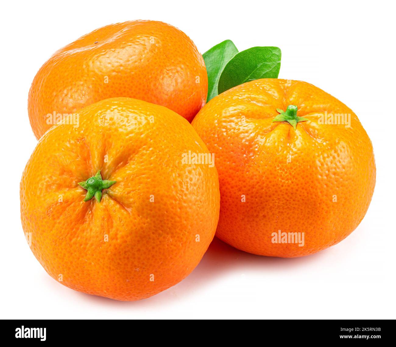 Three mandarin fruits with leaf on white background Stock Photo - Alamy