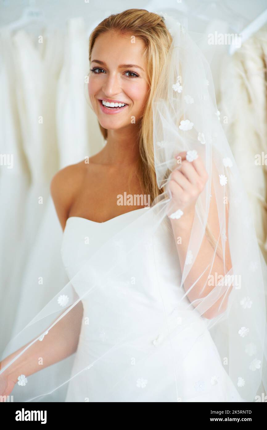 Getting excited for her wedding day. Portrait of a young bride in her ...