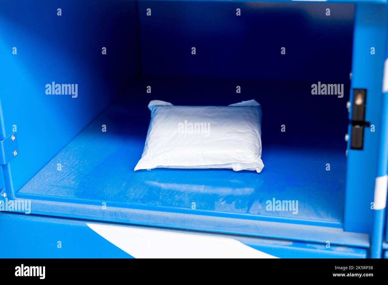 Parcel in locker of automated postal box. Package delivered to the ...