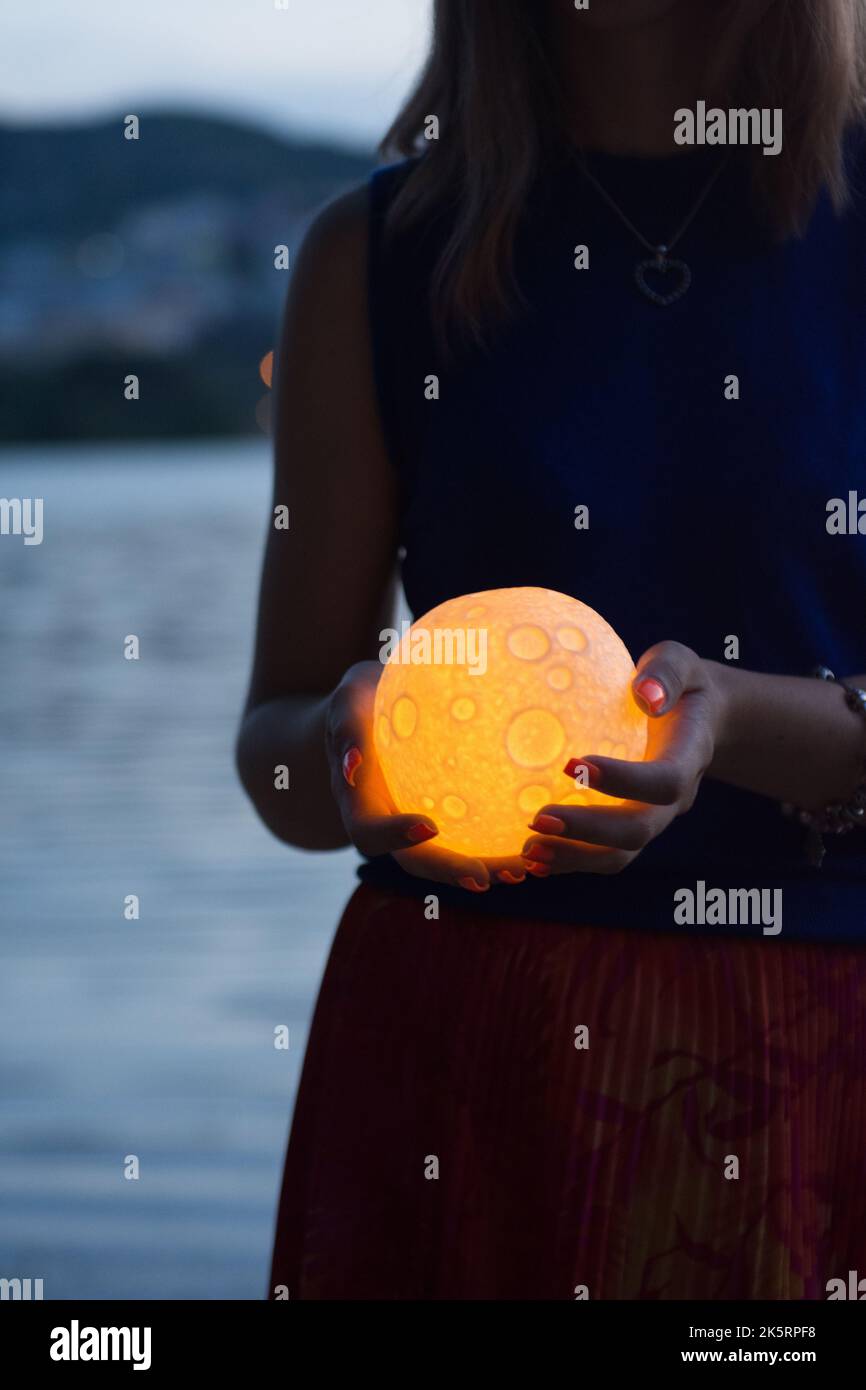 Close up moon in woman's hands. Astrology concept Stock Photo - Alamy