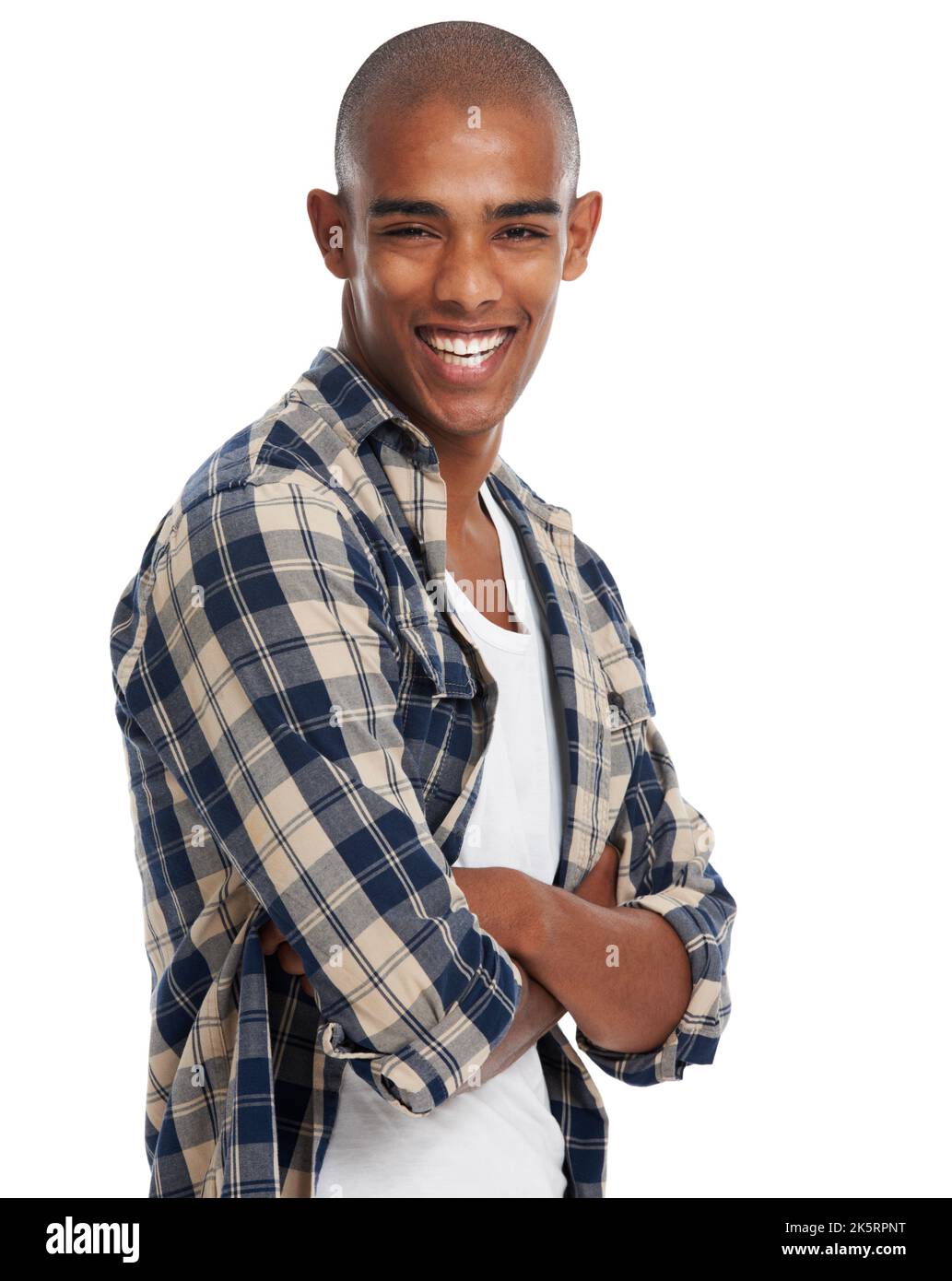 Enjoying the casual life. a young man standing against a white ...