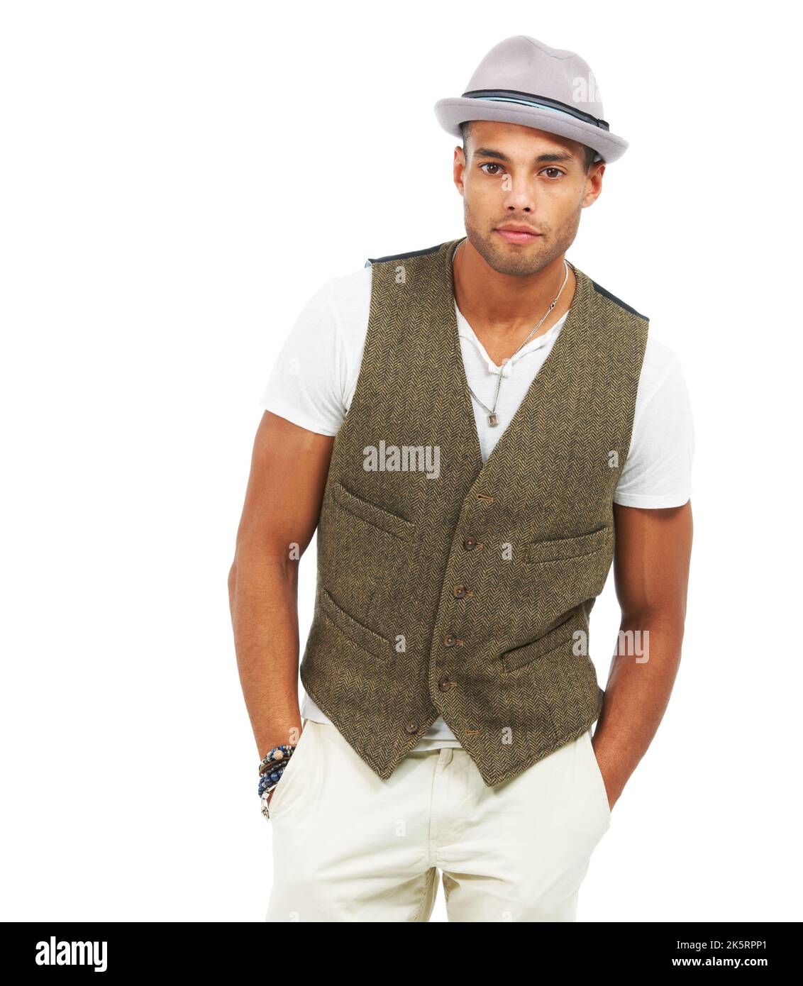 Easy-going style. Trendy young man standing casually with hands in ...