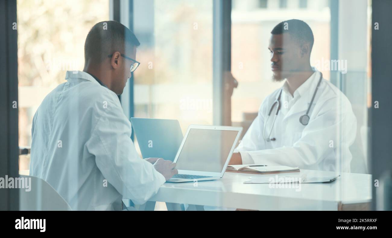 Team of medical doctors working together. Two doctors working on their ... Team of medical doctors working together. Two doctors working on their ...