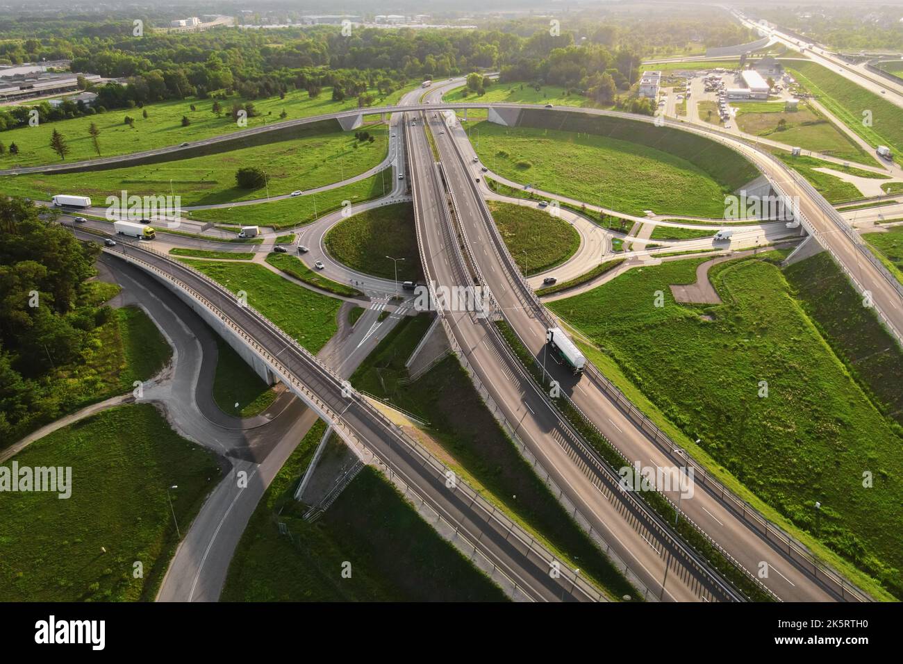 Aerial view of cars driving on round intersection in city ...