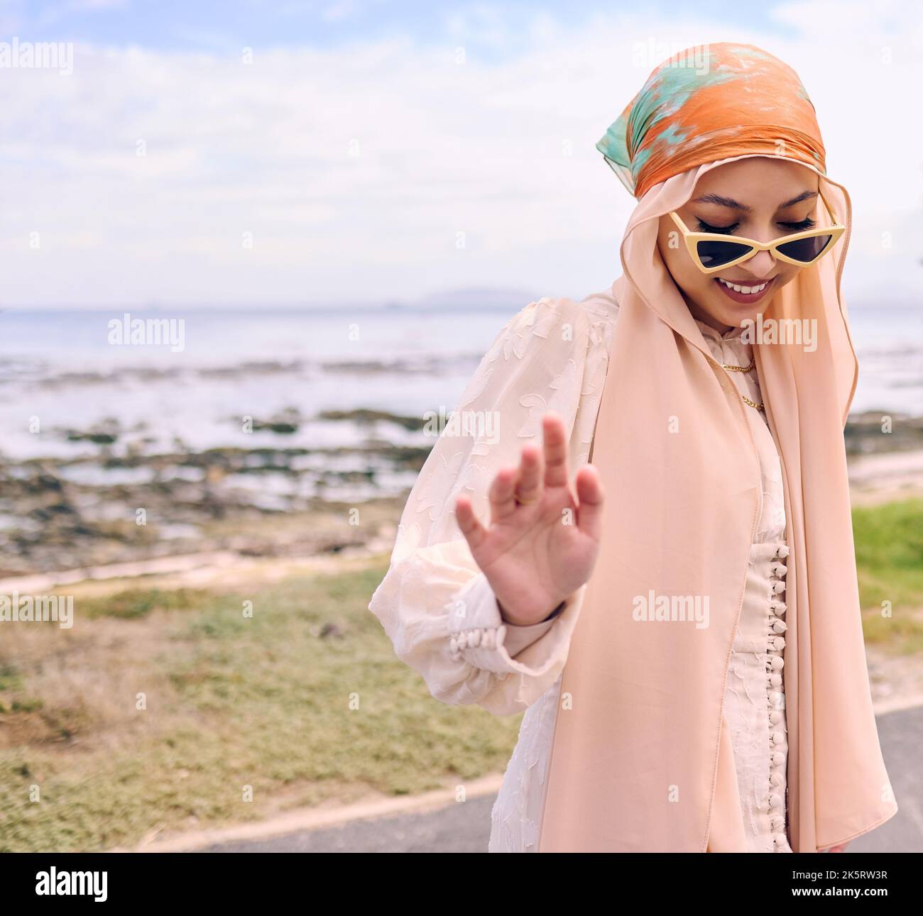 Beautiful young arab woman posing outdoors in a headscarf. Attractive ...