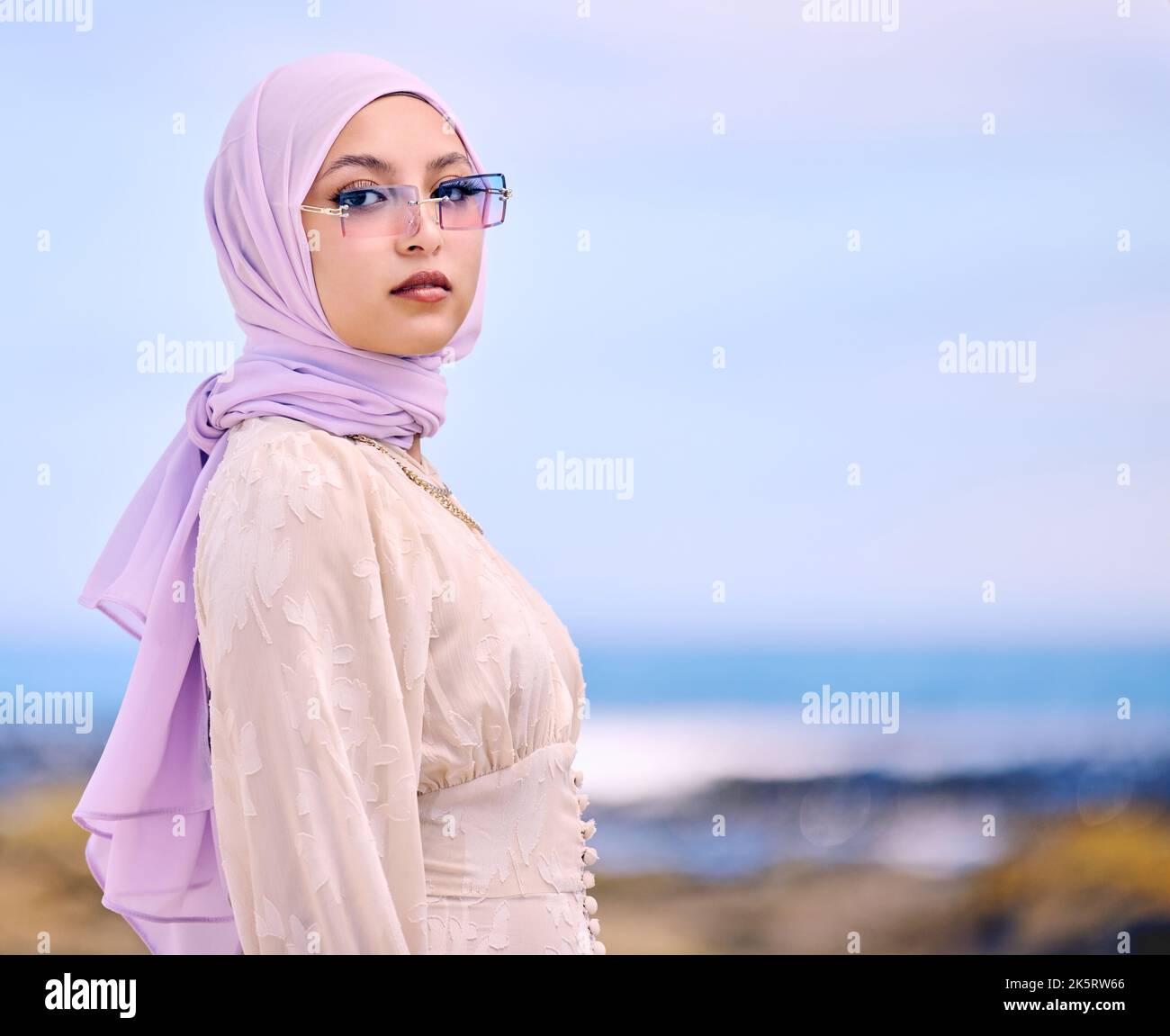 Beautiful young arab woman posing outdoors in a headscarf. Attractive ...