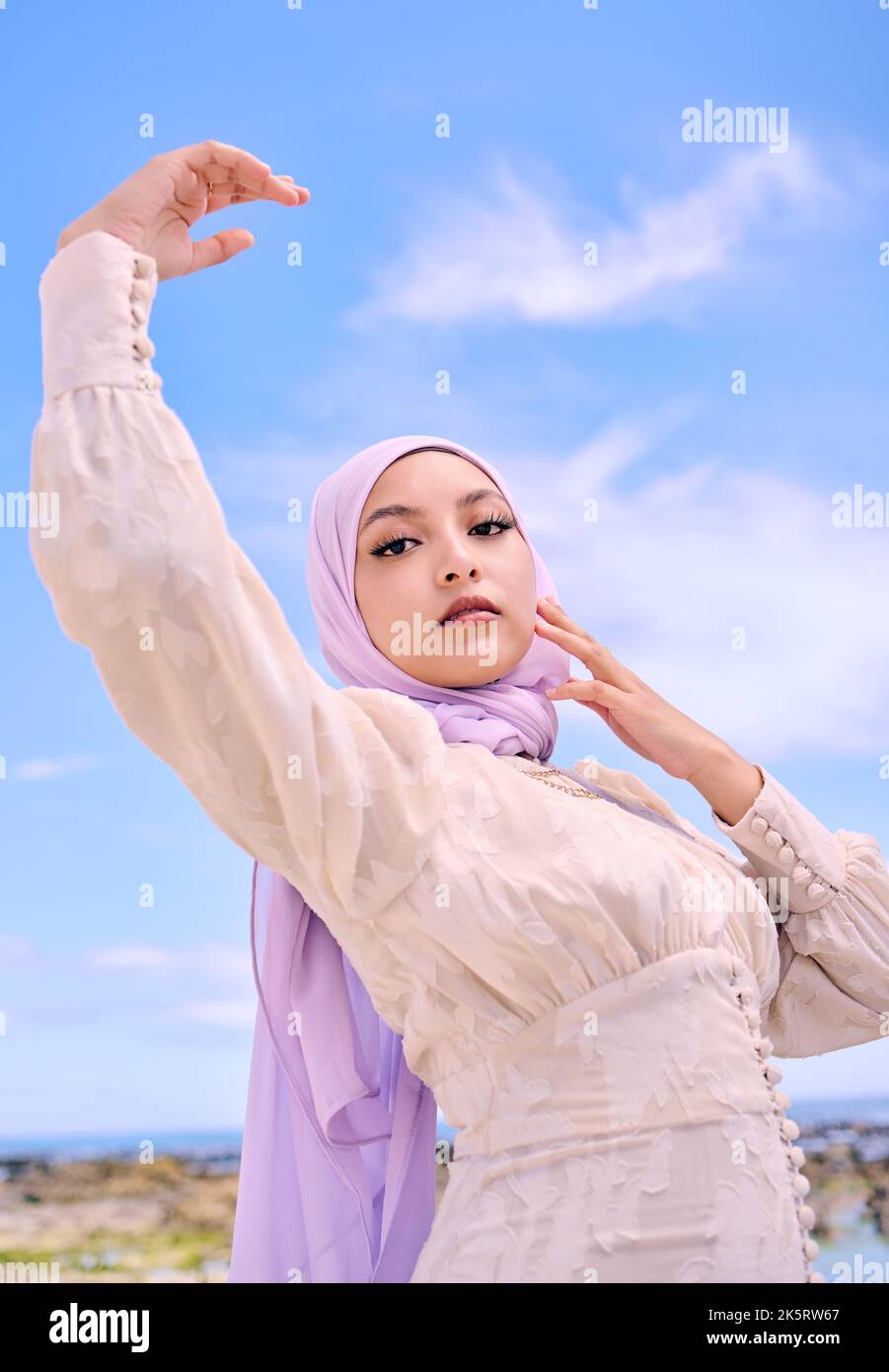 Beautiful young arab woman posing outdoors in a headscarf. Attractive ...