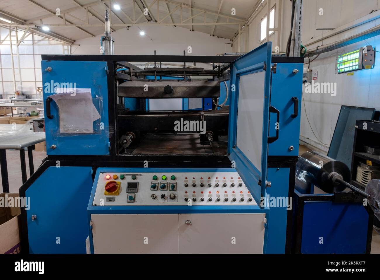 Single station thermoforming machine, side cover open in production ...