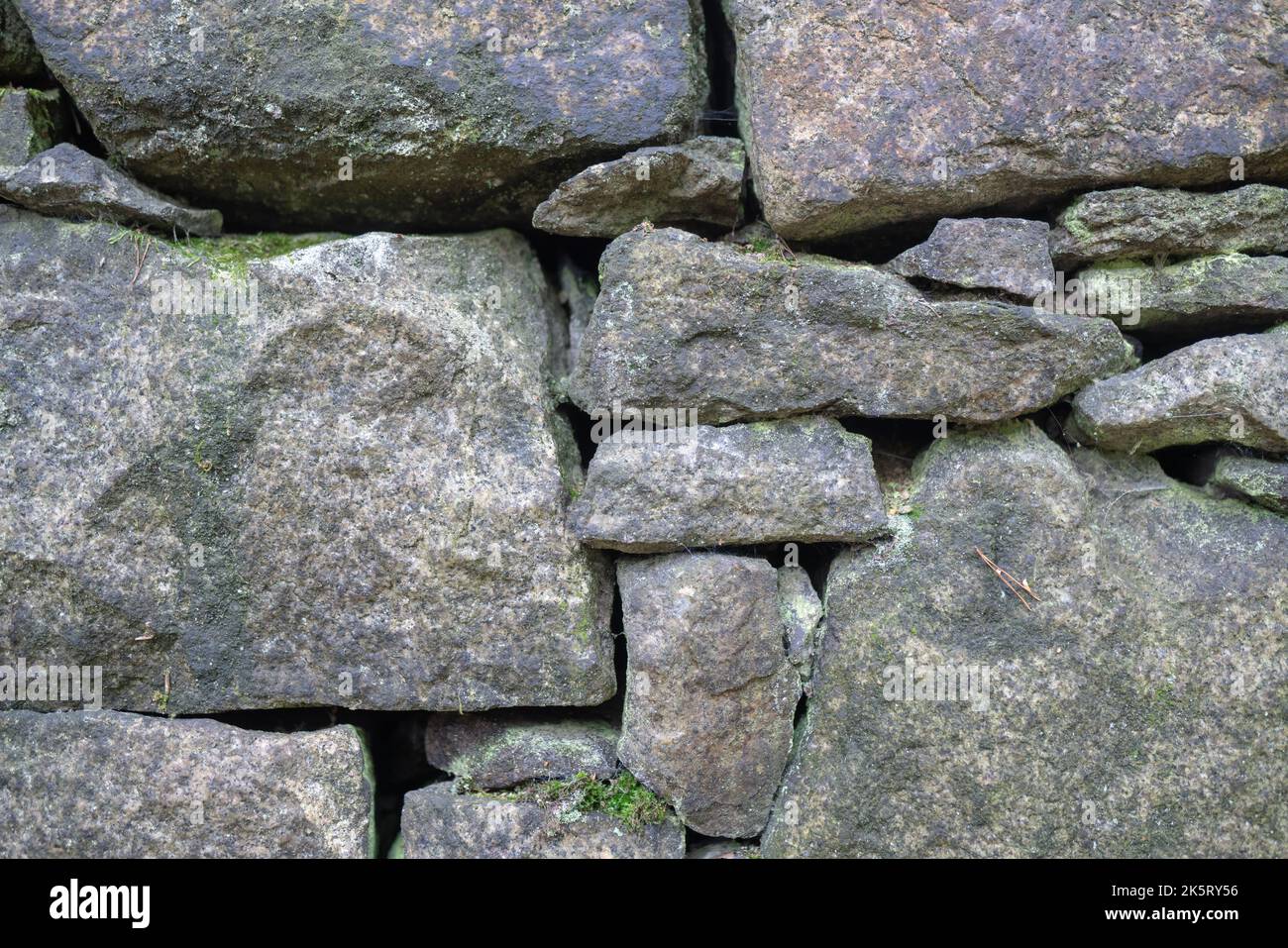 Detail of a stone wall holding a heap in a former granodiorite quarry ...