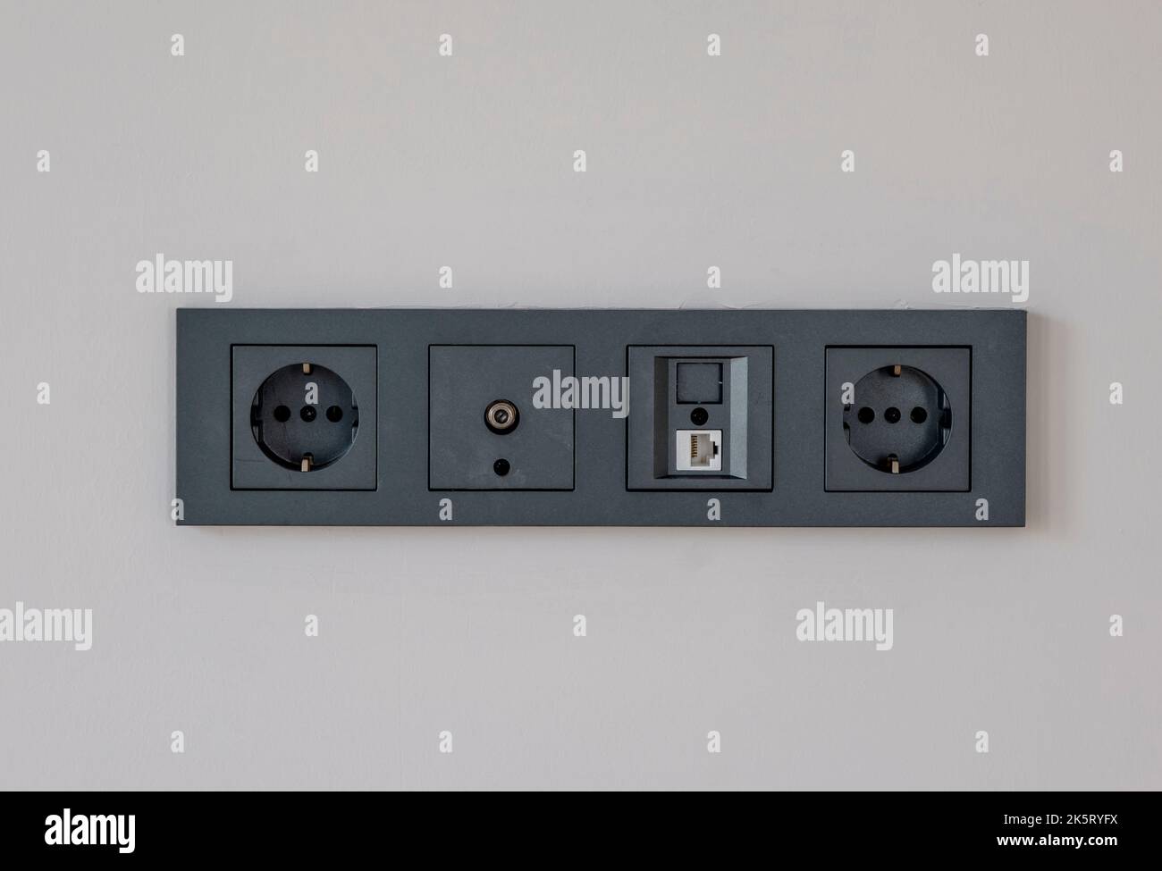 Wall outlet with different sockets. Multi panel, internet, tv or radio ...