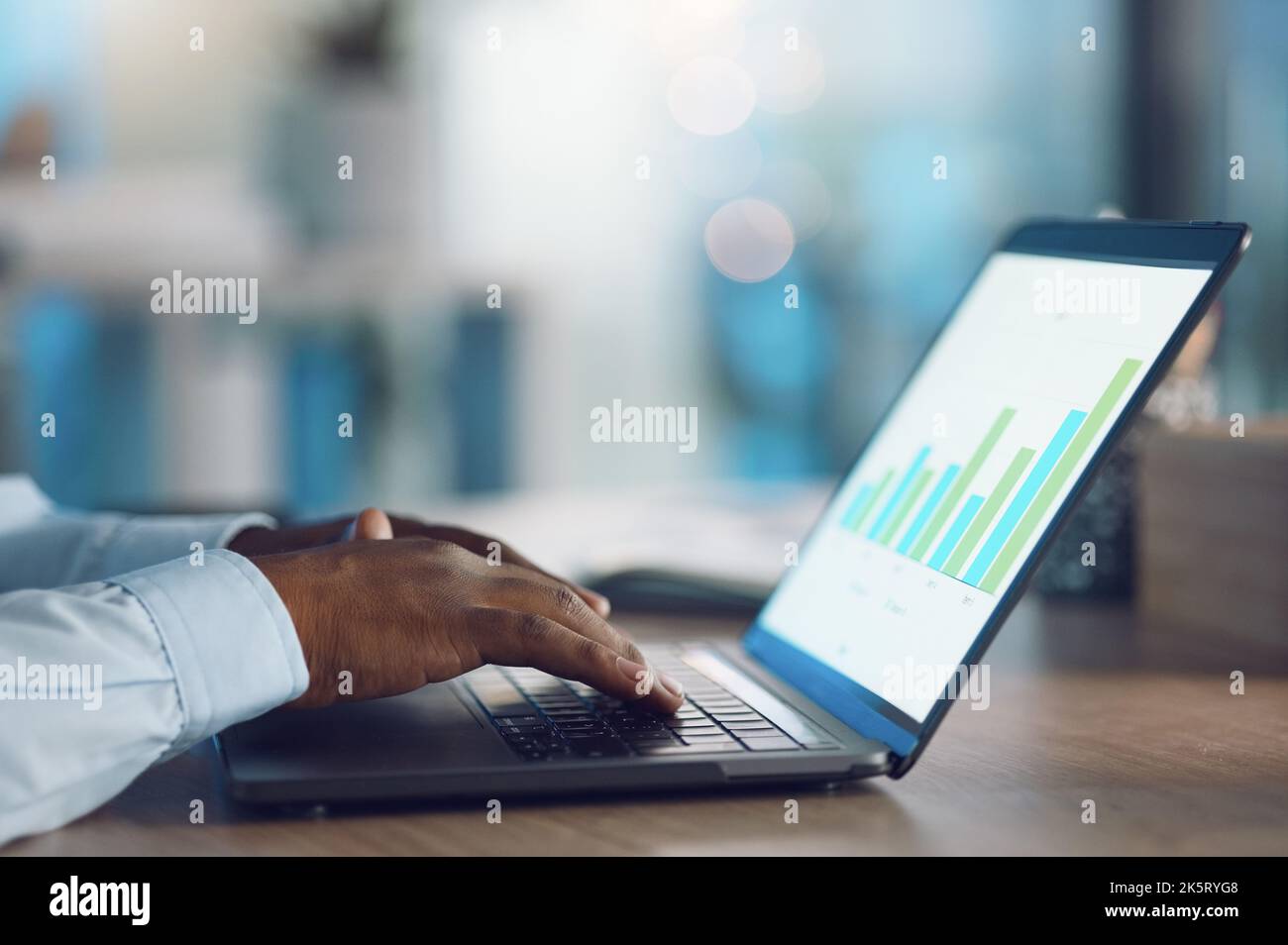 Closeup hands of african man working on a laptop. African american ...