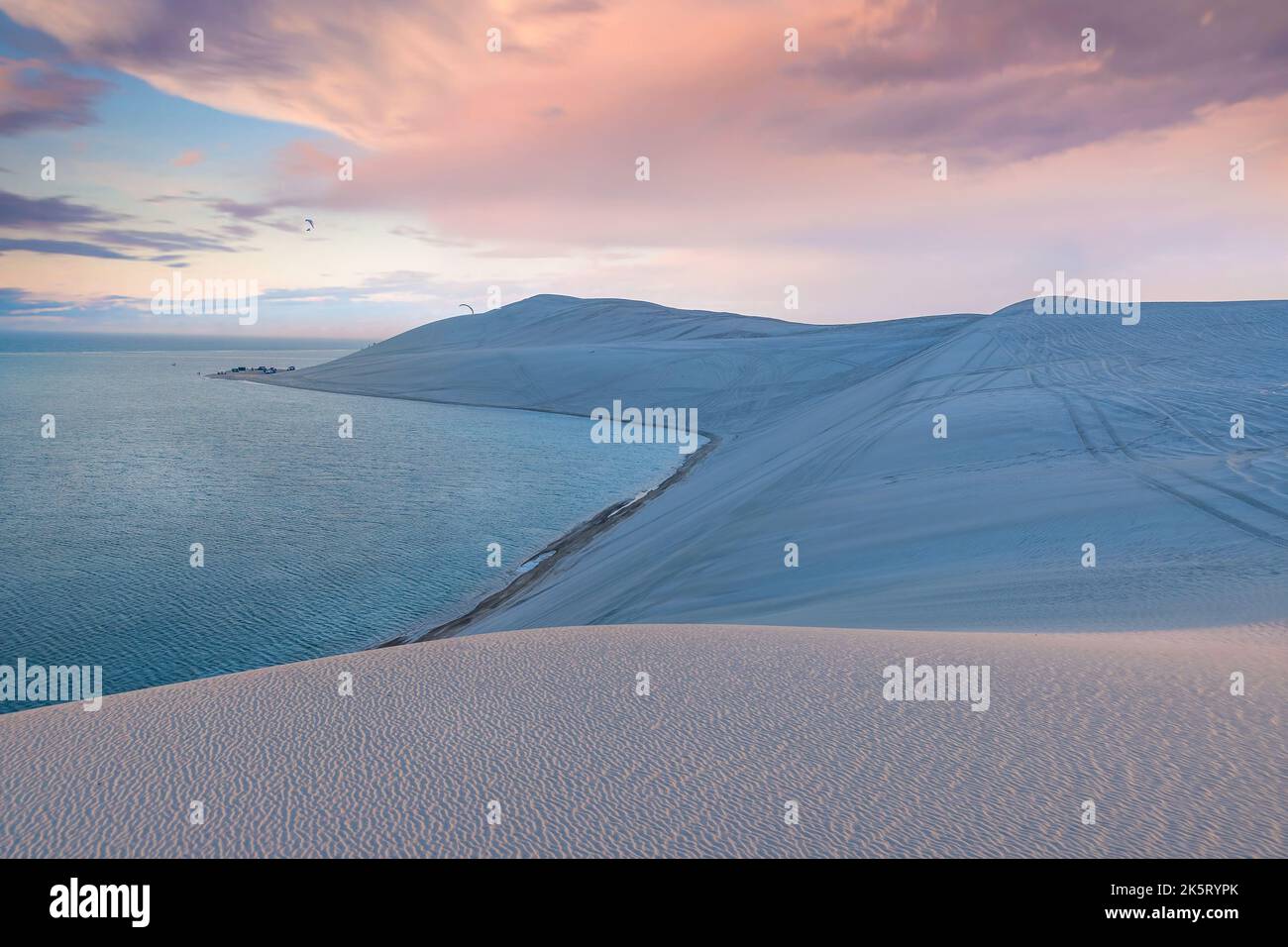 Desert at sunrise, morning glow over dunes inland sea of the Sea line ...