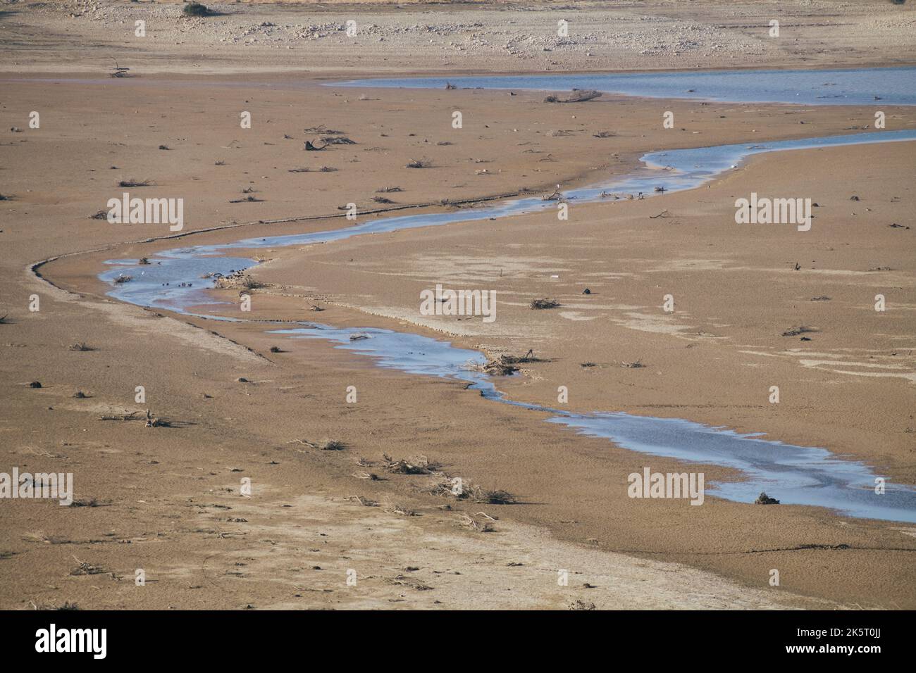 Concept: drought. Large river bed with low flow level due to global ...