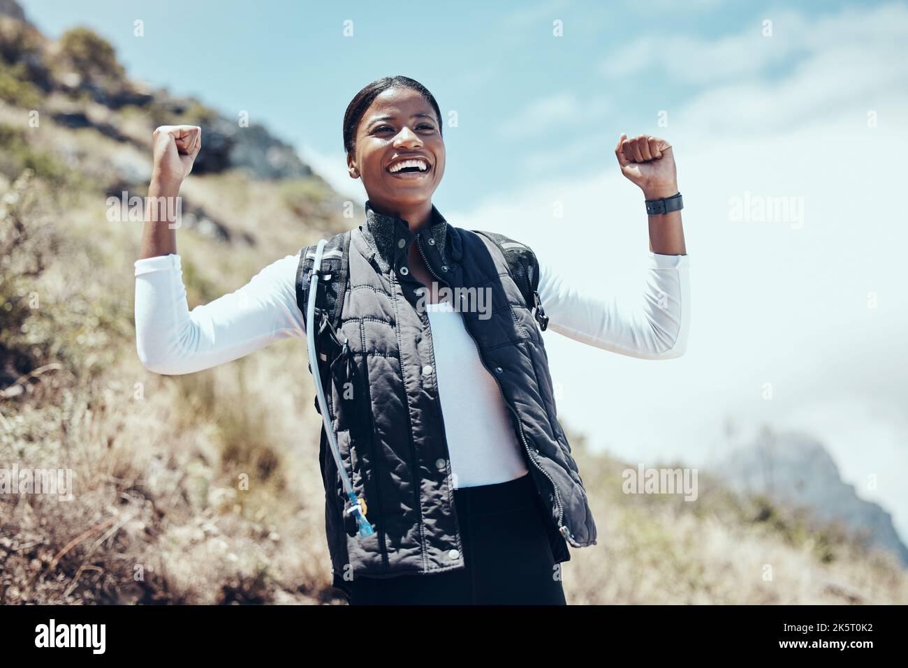 Hiking, success and black woman on mountain in nature while on an ...