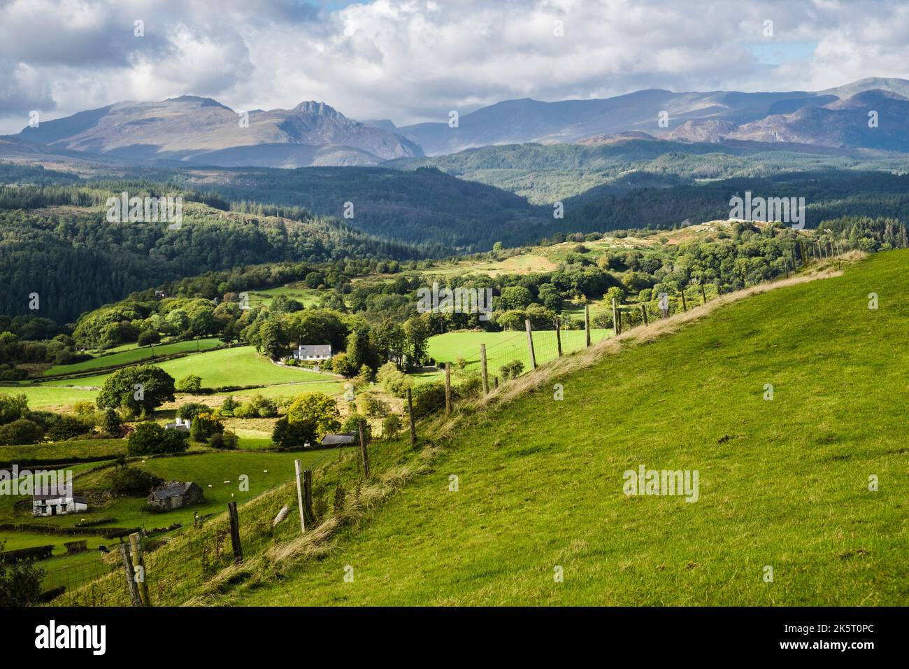 Welsh countryside with view west to mountains of Snowdonia National ...