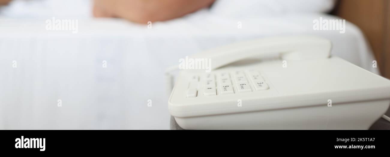 Phone on background of a hotel room Stock Photo - Alamy
