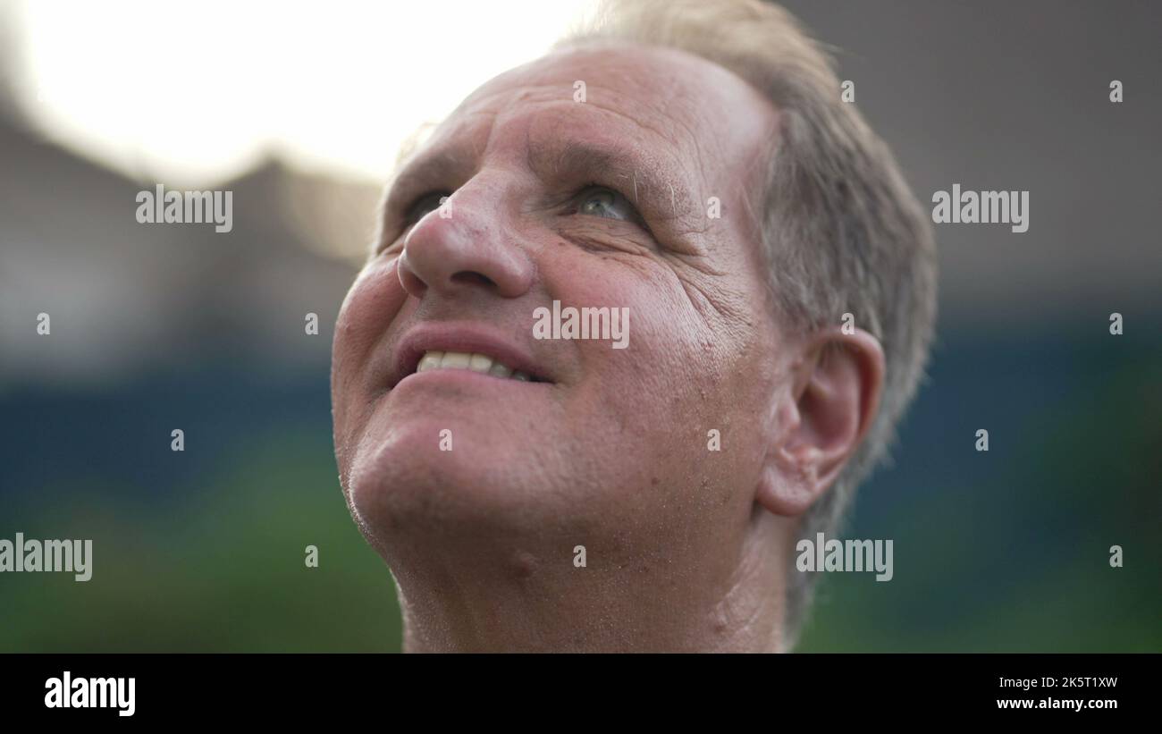 Happy Mature man closeup face looking up at sky with HOPE and FAITH ...