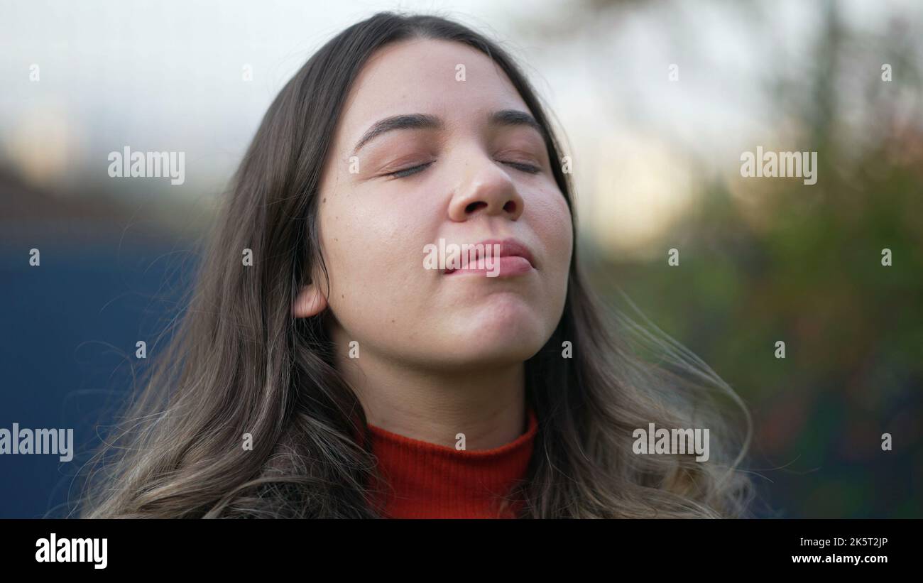 Serene peaceful young woman closing eyes in contemplation. Spiritual ...