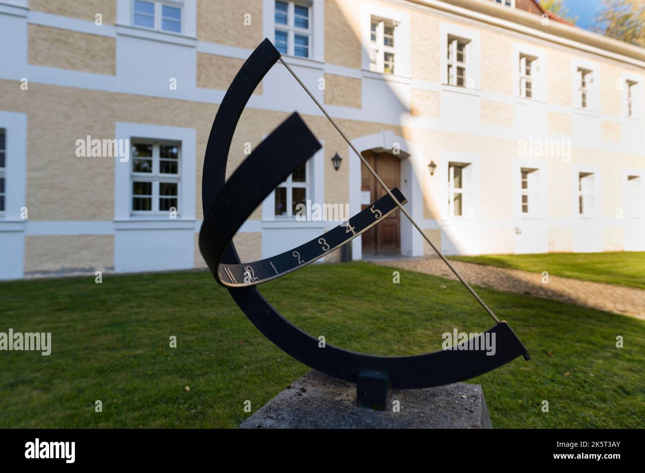 A sundial in the shade Stock Photo - Alamy